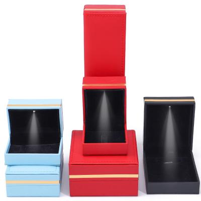 China Custom PU Leather LED Jewelry Box Gold Trim Jewelry Holder Case for Earrings Rings 300 Pcs MOQ for sale