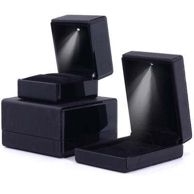 China Custom Black Leather LED Light Jewelry Box with Handmade Craft and Logo Options for sale