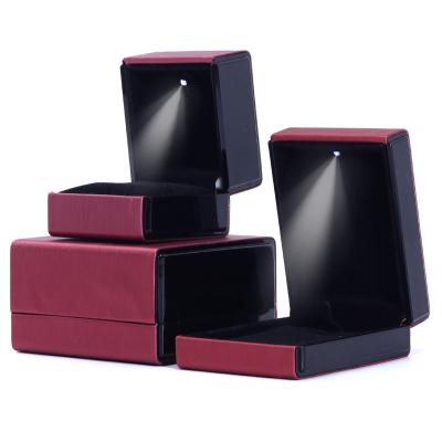 China Custom LED Light Leather Jewelry Box for Bracelets Necklaces Rings 30x20x10cm for sale