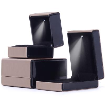 China Custom Gold LED Jewelry Box 9x9x5cm Rectangle for Necklace Bracelet Ring for sale