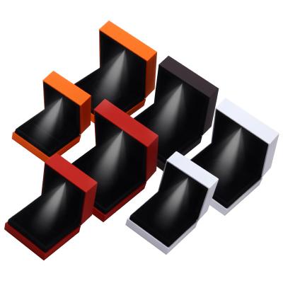 China 9×9×3.5cm LED Ring Jewelry Box with Custom Logo and Baked Lacquered Black Rimmed Design for sale