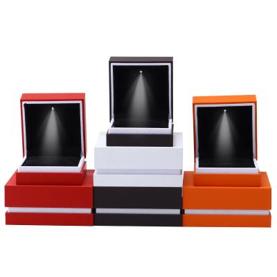 China Custom LED Ring Jewelry Box 9x9x3.5cm PU Leather Baking Paint White Edge for sale