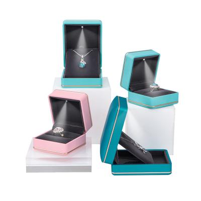 China Custom LED Jewelry Storage Box with Silk Screen Printing - Double Gold Rimmed Ring Box with Velvet Interior for sale