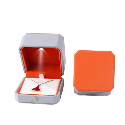 China Custom Gray Leather Jewelry Box with Octagonal Gold Buckle for Rings and Pendants for sale