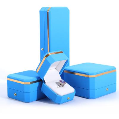 China Blue PU Leather Jewelry Box Octagonal Metal Button Custom Logo Gift Case for sale