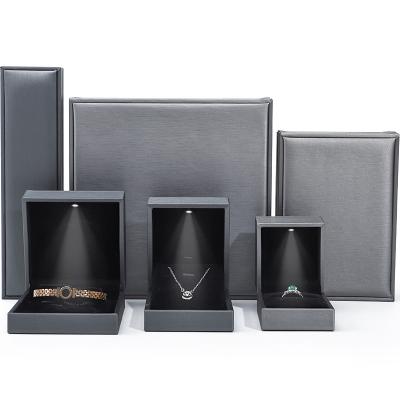 China Grey PU Leather LED Jewelry Box Customizable Size for Bracelet Necklace Ring Display for sale