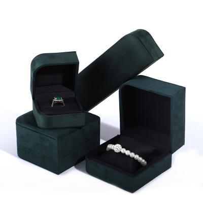 China Green Microfiber Leather Jewelry Case 7x7x5cm for Earrings Rings Custom Logo for sale