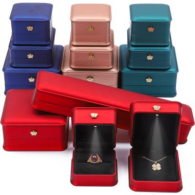 China Custom PU Leather LED Light Jewelry Box with Golden Crown for Necklace Bracelet Ring Earrings 300 Pcs MOQ for sale