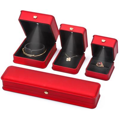 China Custom Logo LED Light Red Color Jewelry Box Set with PU Leather and Velvet Options for sale