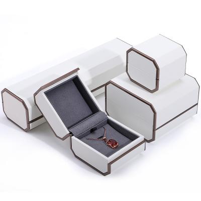 China Custom White PU Leather Jewelry Case for Rings Necklaces Bracelets with Velvet Interior for sale