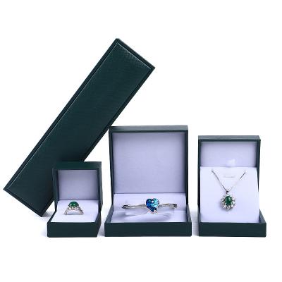 China Custom Green Velvet Jewelry Packaging Box with Embossed Logo for Necklace Bracelet Ring Earrings for sale