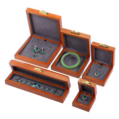 China Custom Embossing Logo Luxury Wood Jewelry Box 6.5x6.5x4.5cm with Metal Buckle for Bracelet Necklace Set Packaging for sale