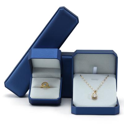 China Custom Navy Convex Faux Leather Jewelry Box Durable Luxury Packaging Case 300000 pcs Monthly for sale