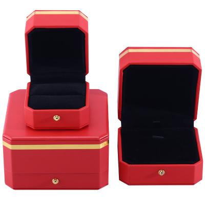 China Eye-Catching Red Octagonal PU Leather Luxury Packaging Box with Gold Trim for sale