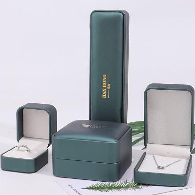China Customizable Dark Green Faux Leather Jewelry Storage Box Luxury Organizer Packaging 300000 pcs Monthly Supply for sale