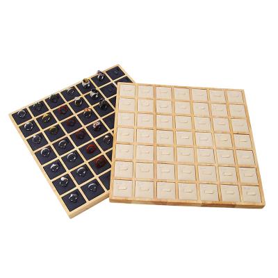 China 7x7 Wooden Jewelry Display Tray with 49 Ring Positions - Custom Logo & Color Options for sale