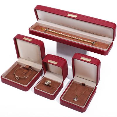 China Floating Effect Red PU Leather Luxury Jewelry Box Set with Gold Bar Custom Size for sale
