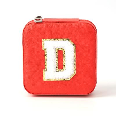 China Portable Small Leather Red Jewelry Storage Box with Multiple Compartments for Organized Display and Protection for sale
