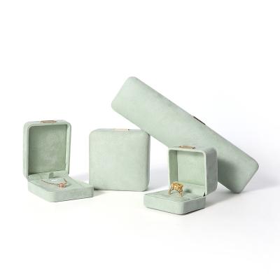 China Octagonal Light Green Velvet Jewelry Box Customizable Flip Box with Golden Patch 8 Inch for sale