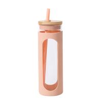 China Bamboo Sports Cap Glass Drinking Bottles 20oz With Protective Silicone Sleeve for sale