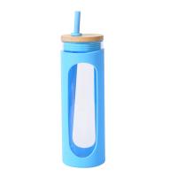 China Bamboo Sports Cap Glass Drinking Bottles 20oz With Protective Silicone Sleeve for sale