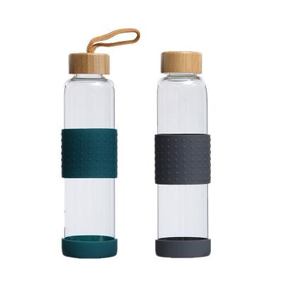 China 400ml Protective School Kids Glass Drinking Bottles With Silicone Cover for sale