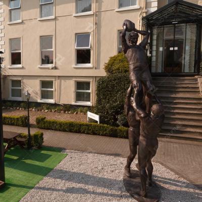 China 6m Tall Bronze Sports Sculpture Patina Finish Outdoor Rugby Athlete Statue for sale