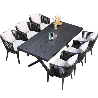 China Outdoor Rattan Dining Set 6 Seats Waterproof UV Resistant Patio Furniture for Garden Terrace Courtyard for sale