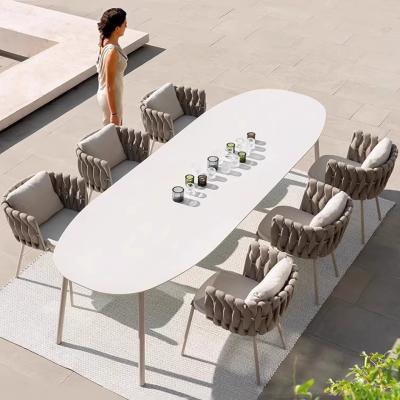 China Nordic Minimalist Outdoor Dining Set 4 Seats Woven Rope Patio Table and Chair Combo for Garden Terrace for sale