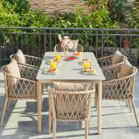 China Commercial Outdoor Dining Set 6 Chairs Sintered Stone Tabletop Aluminum Frame UV Resistant Rope Weaving for sale