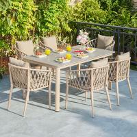 China Commercial Outdoor Dining Set 6 Chairs Sintered Stone Tabletop Aluminum Frame UV Resistant Rope Weaving for sale