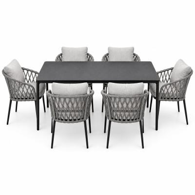 China Outdoor Dining Set with Gray Rope Woven Armchairs Matte Dark Charcoal Tabletop and Thick Light Gray Cushions for sale