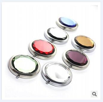 China Custom Logo Folding Stainless Steel Pocket Mirror 7cm with Crystal Accents for sale