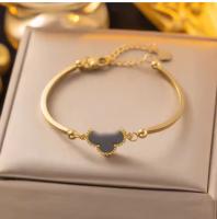China Waterproof Black Red Clover Bangle 18K Gold Stainless Steel Four Leaf Bracelet for sale