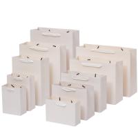 China 100g-130g Kraft Recycled Paper Gift Bag Easy Carry With Handle for sale
