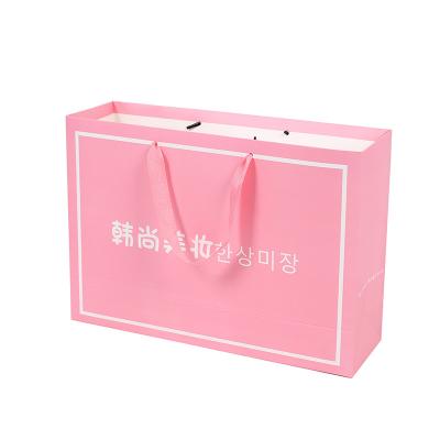 China 100g-130g Kraft Recycled Paper Gift Bag Easy Carry With Handle for sale