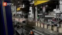 China SPC-D550 Fully Automatic High-Speed Glass Bottle Label Sleeving Machine 42,000 BPH with Dual Servo Heads for sale