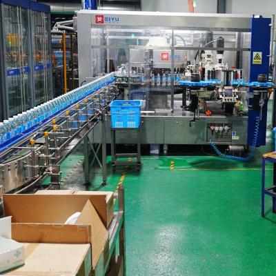 China 3000 BPH Full Automatic Barrel Water End of Line Secondary Packing Machine with Hot Melt Labeling for 100-2000ml for sale