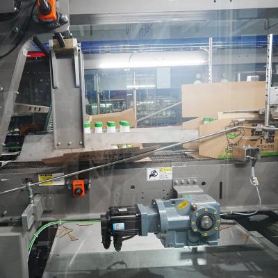 China 30kw Fully Automatic Wrap Around Case Packer Cartoning Machine with 45box/Minute Capacity and Mechanical Stretch for sale