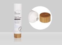 China 35-110ml Bamboo Tube Packaging Empty Custom Moisturize Lotion Cosmetic Plastic Tube With Wood Cover for sale