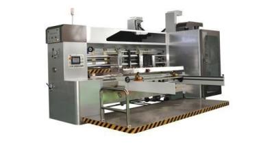 China Four Color Flexo Printing Slotting Die Cutting Machine With Automatic Lead Feeder for sale