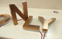 China 304 Stainless Steel Titanium Plated Brushed Gold Backlit Lettering 12mm Acrylic LED Sign for sale