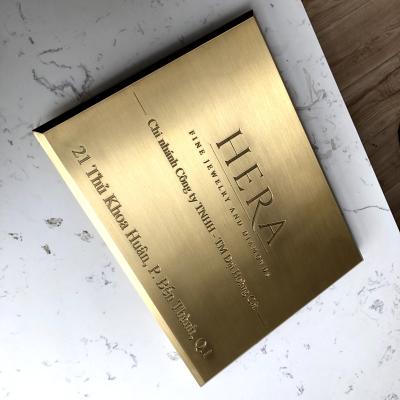 China Customizable  high-end solid brass signage and plaques featuring engraved brand logos and lettering for businesses and offices. for sale