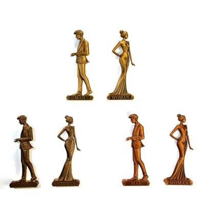 China Custom restroom signs for men and women, carved from 15mm solid aluminum plate using 3D relief craftsmanship. for sale
