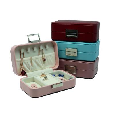 China Lightweight Mini Portable Travel Jewelry Box With Handle Many Compartments for sale
