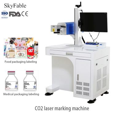 China Food Packaging Dedicated Pharmaceutical Label Engraving Machine High Speed Laser Coding Equipment for sale