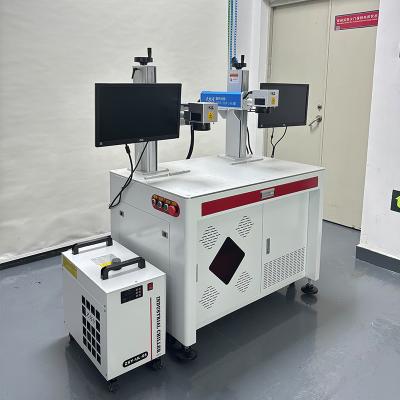 China Dual-Head Dual-Station Fiber Laser Marking Machine with 100000hours Laser Life 0.05mm Spot Size and ≤7000mm/s Engraving Speed for sale