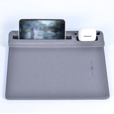 China Qi Wireless Charger Desk Mat 10W Fast Charging Leather Desk Pad 34x23cm with Custom LED Logo for sale