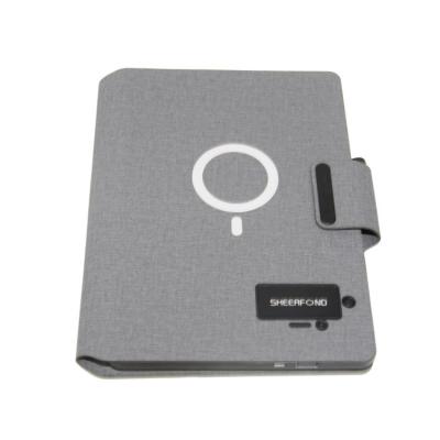 China PU Leather Wireless Charging Power Bank Notebook with Custom LED Logo 10000mAh Magnetic Attraction for sale
