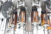 China 200ml-2500ml Automatic Beer Filling Machine With Plastic Caps And Crown Caps for sale